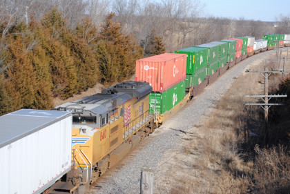 Union Pacific 7836 East with mid-train DPU 8410 came by next.