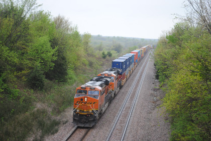 BNSF 4018 West at the Route VV bridge which is the third bridge west of Ethel.