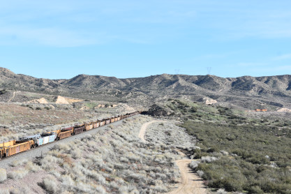 BNSF 7917 East with ES44DC 7917 and C44-9W 5097 on a baretable train.