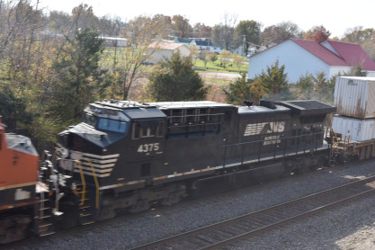 BNSF 6158 East with Norfolk Southern AC44C6M 4375 in the motive power consist.