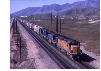 UP 3105 West with a pair of Missouri Pacific units at the Highland Avenue Bridge in April of 1980.