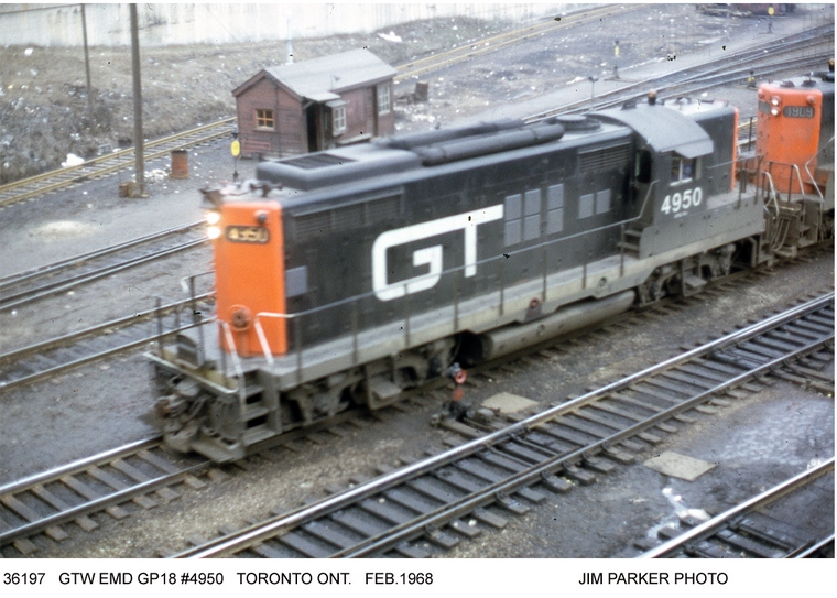 One of just 3 GP18's 4950-4952 leading 4909 westbound at Bathurst Street.
