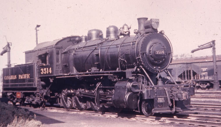 3514 in yard service at an unknown location in 1959. Red box on tender contains fire hose ...