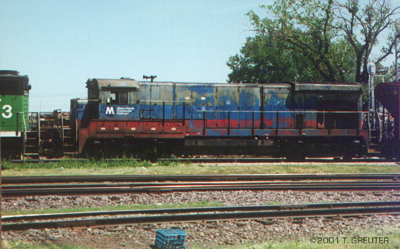 MNCR 807 - a kicked-around B30-7 being leased to the power hungry BN, seen at the state ...