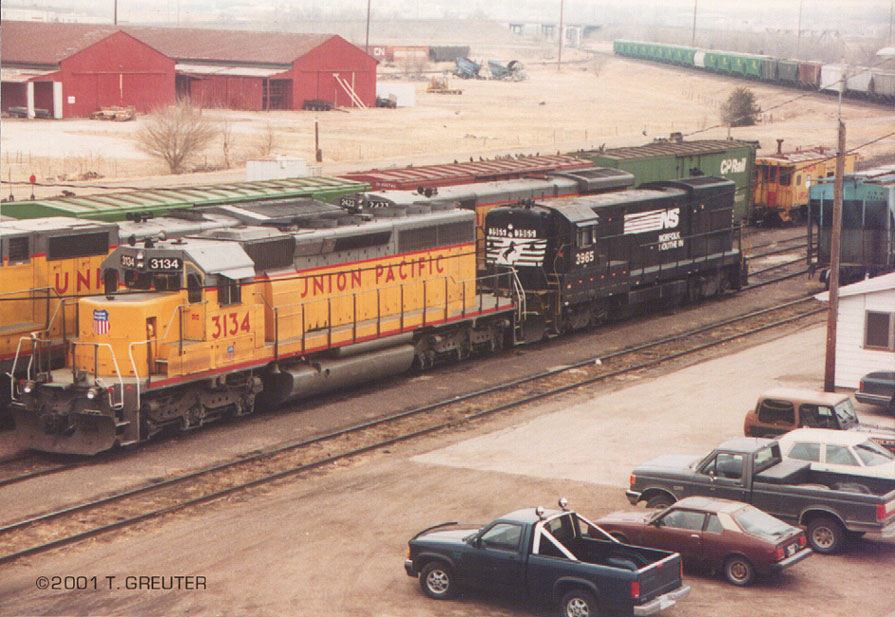 UP 3134 - an SD40-2, with a Norfolk Sourthern B 33 at Lincoln, NE UP's yard. 3/29/96 - T ...